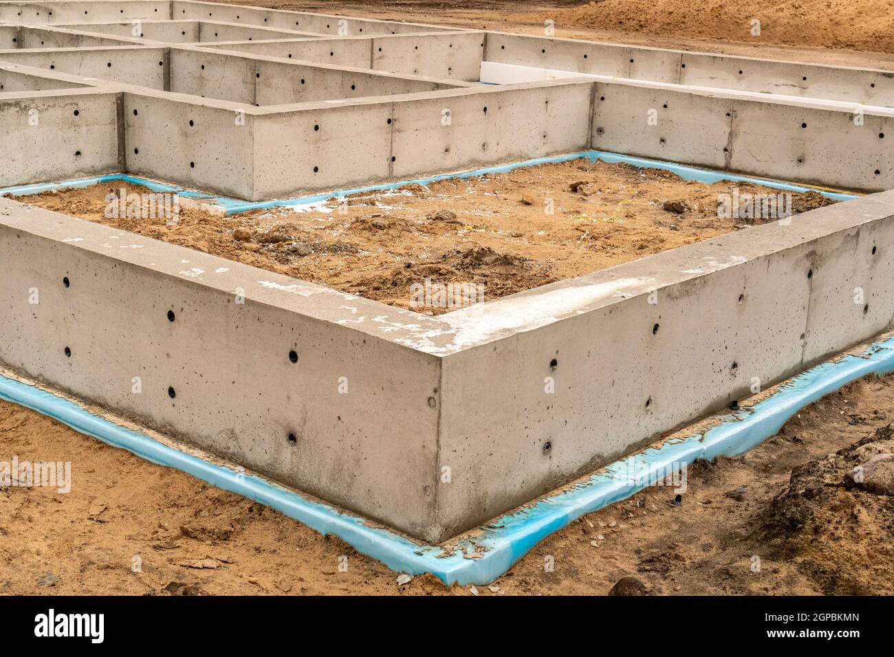 New housing construction site. New concrete house foundation with ...