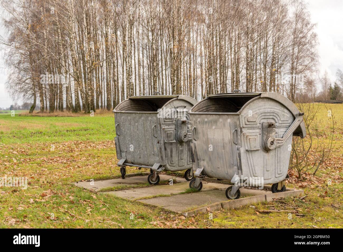 Old metal garbage containers in the countryside Stock Photo - Alamy