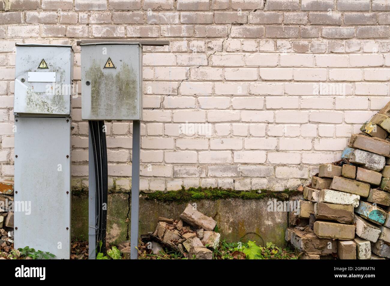 Power supply box on the brick wall of abandoned house Stock Photo - Alamy