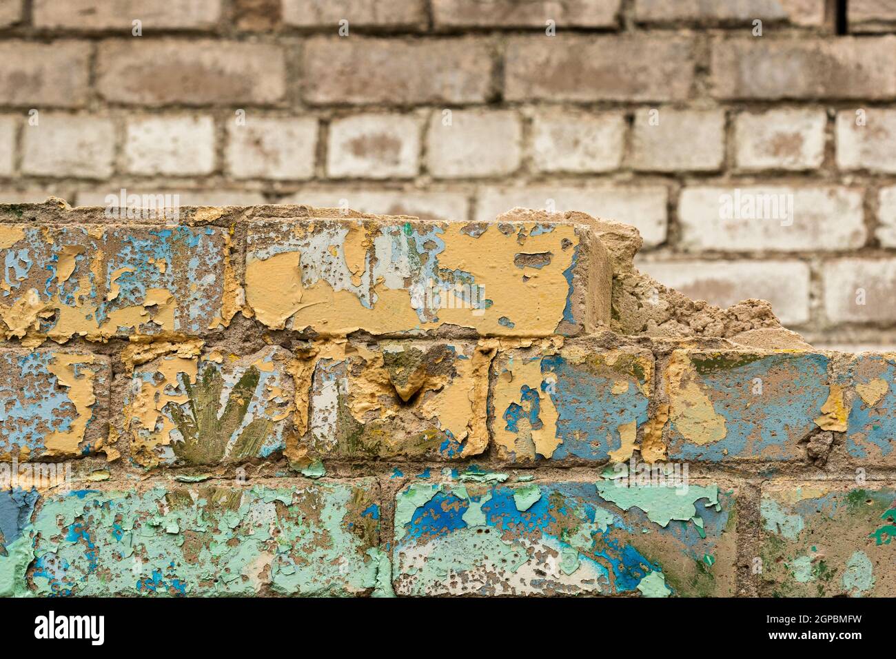 Crumbling brick wall of dismantled building at a demolition site Stock ...