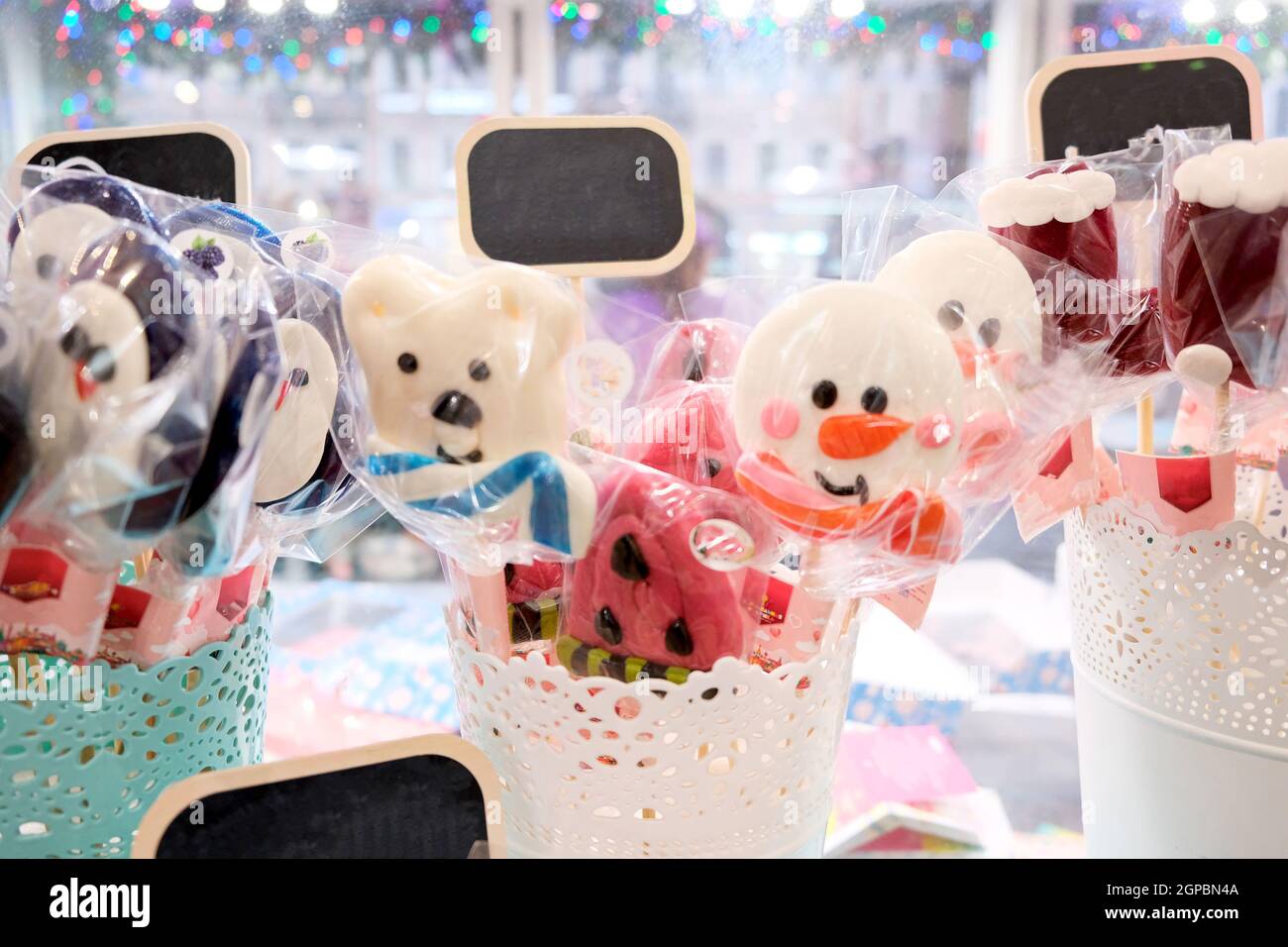 Christmas lollipops in the store during the New Year holidays. tree and ...