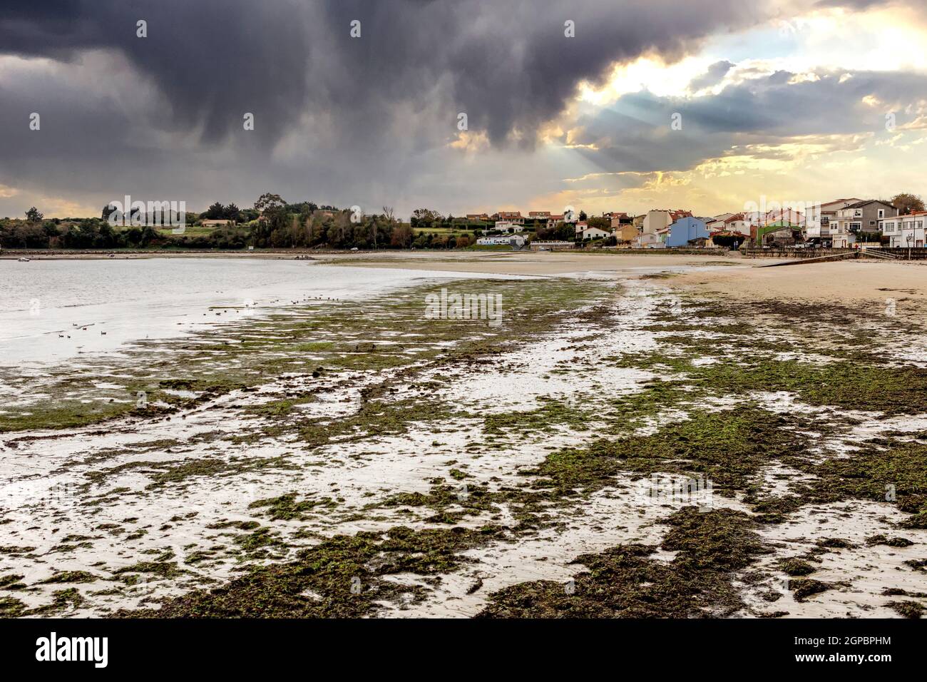Nice seaside Spanish town during the low tide Stock Photo - Alamy