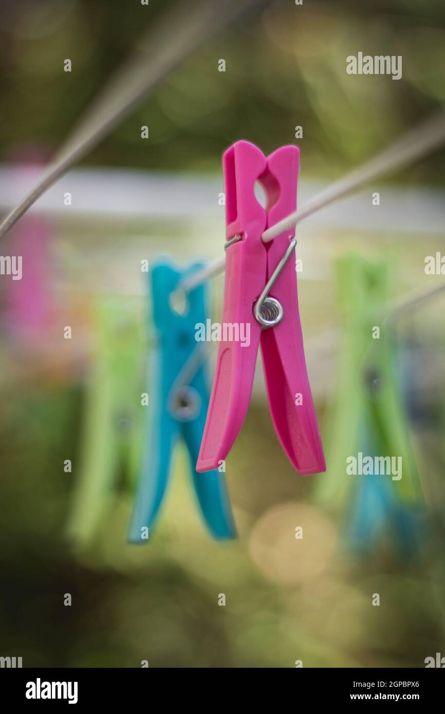 Clothespin clamp on rope, colourful, outdoors Stock Photo - Alamy