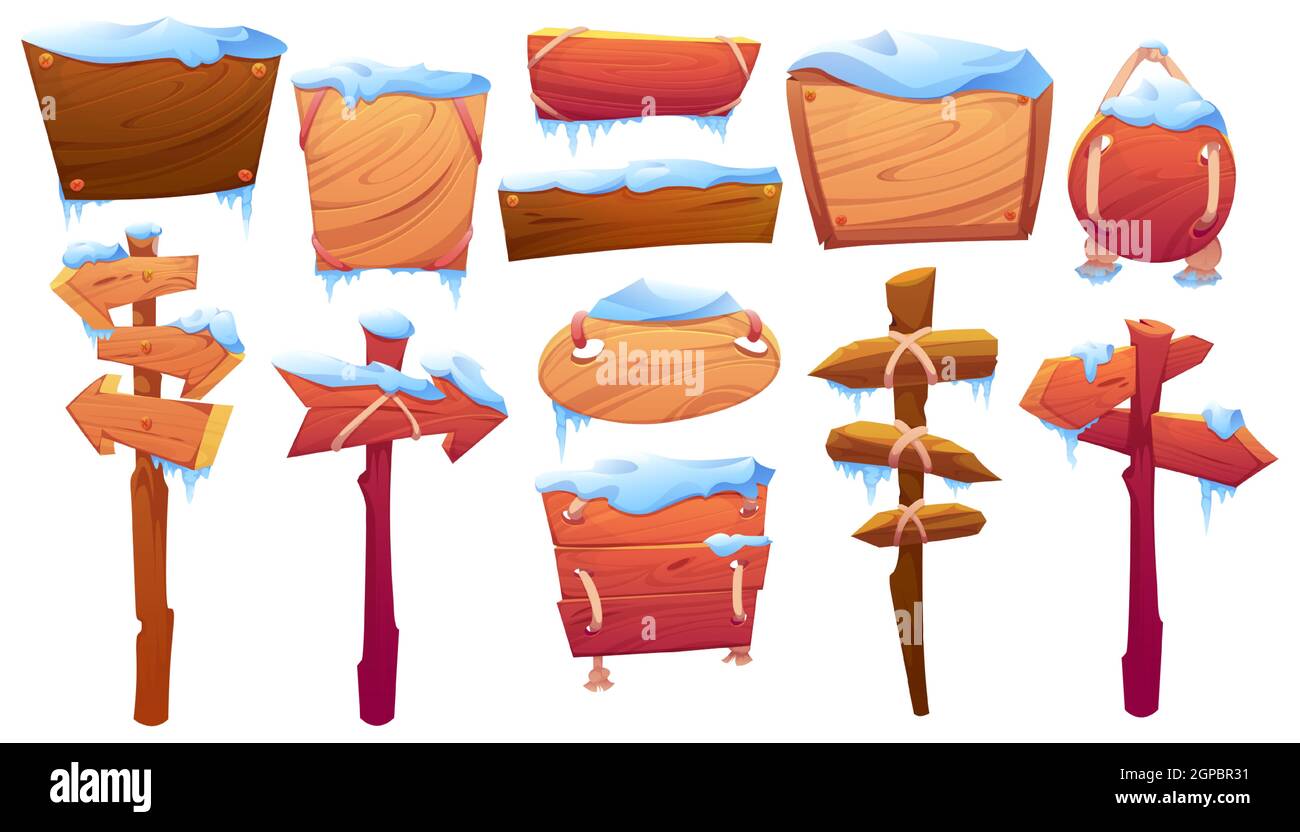 Wooden signboards covered by snow, planks and pointers on post at ...