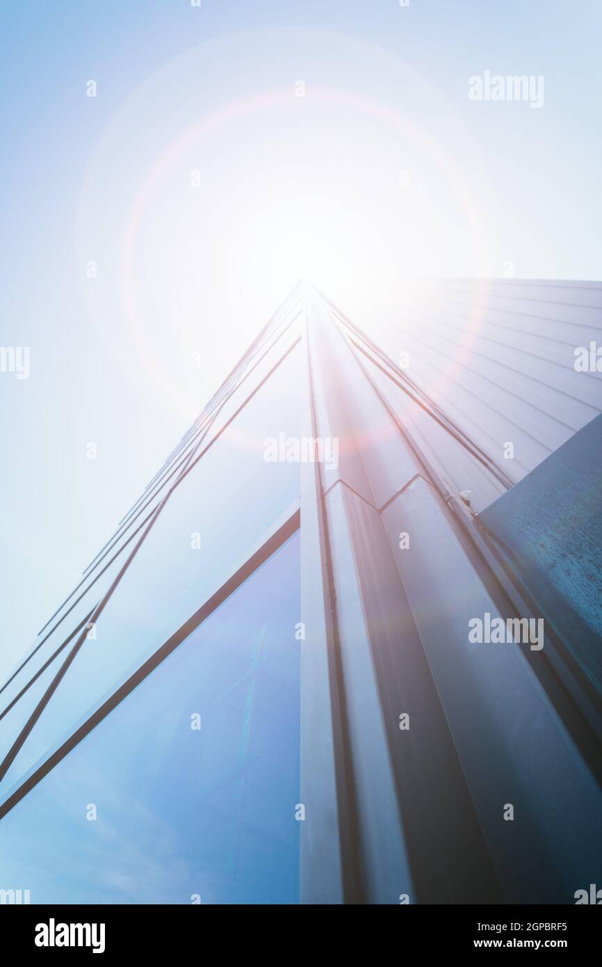 Modern skyscraper out of glass, blue sky and sunbeam Stock Photo - Alamy