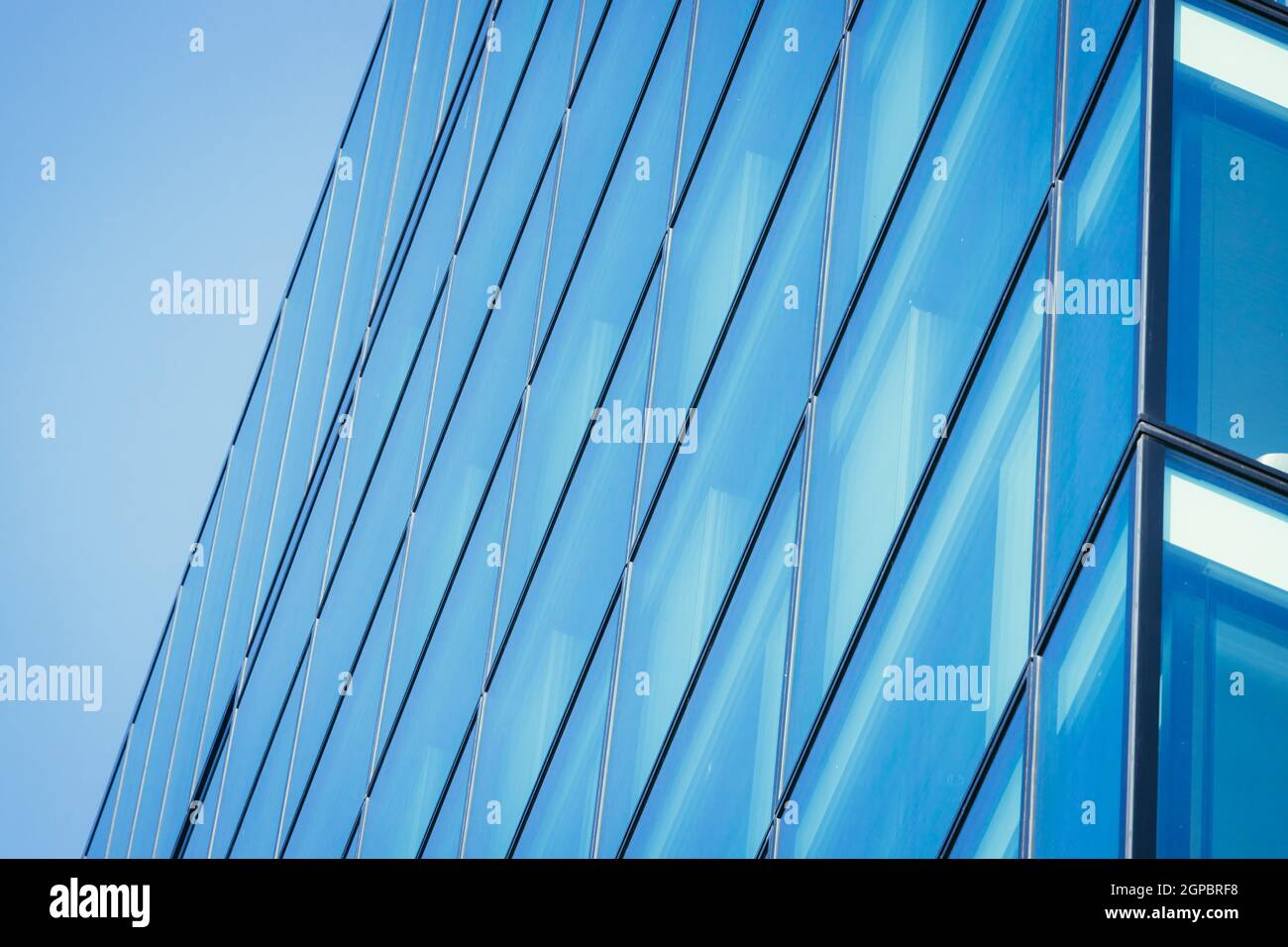 Modern office building: Skyscraper with blue glass Stock Photo - Alamy