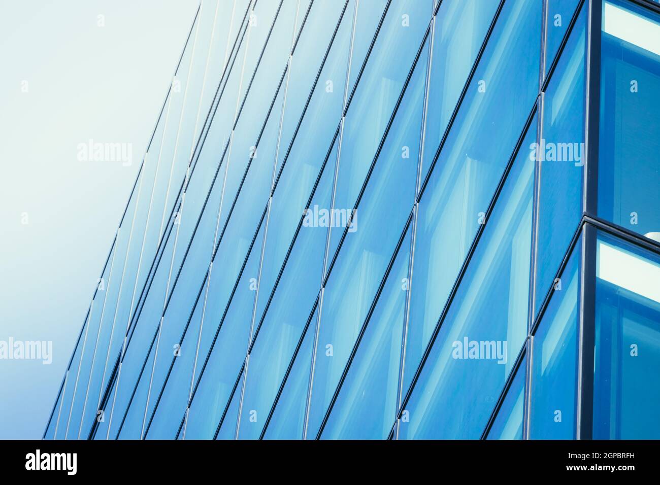 Modern office building: Skyscraper with blue glass Stock Photo - Alamy