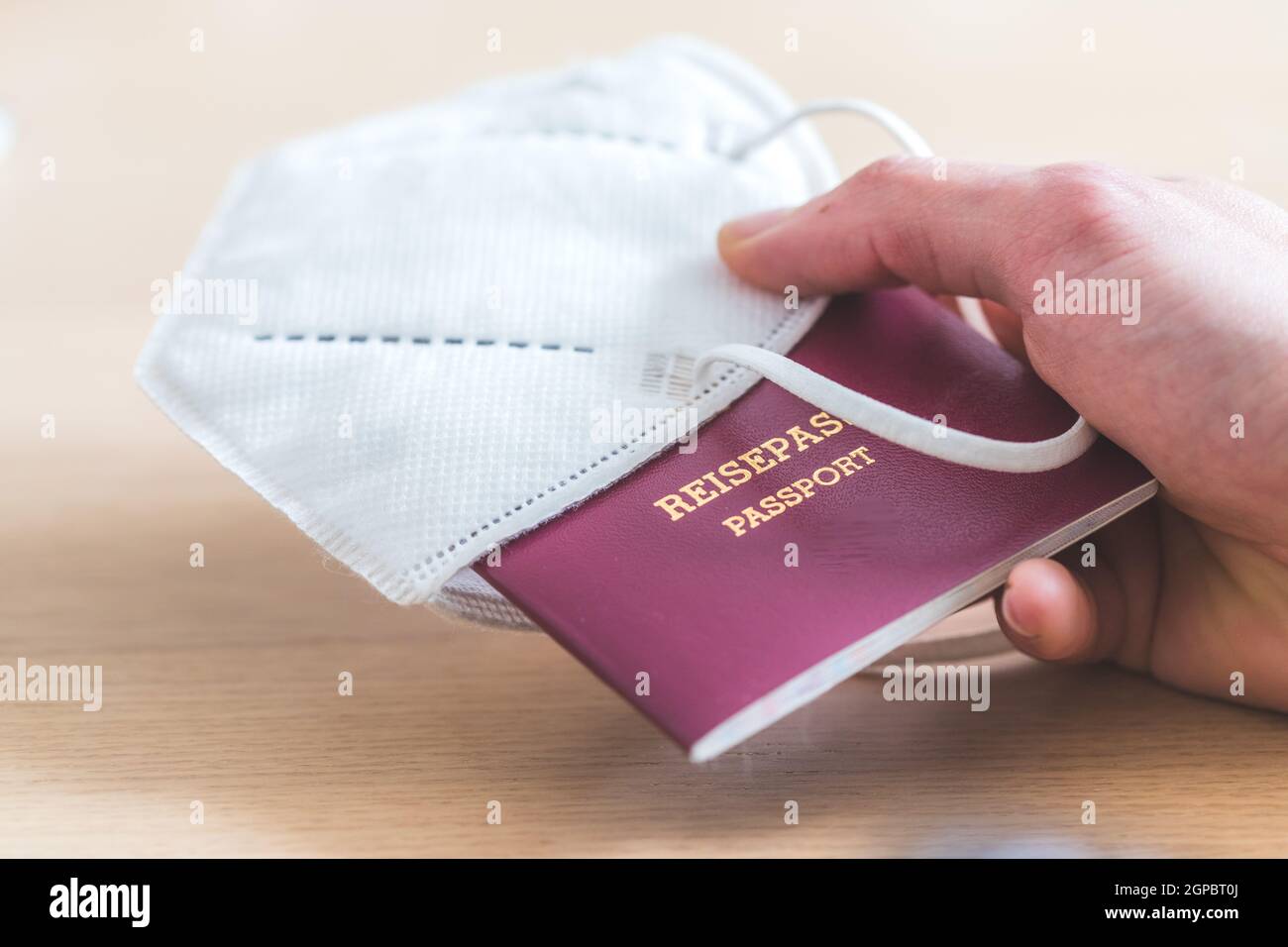 Close Up Of Fingers Holding A Passport For Travelling Airport