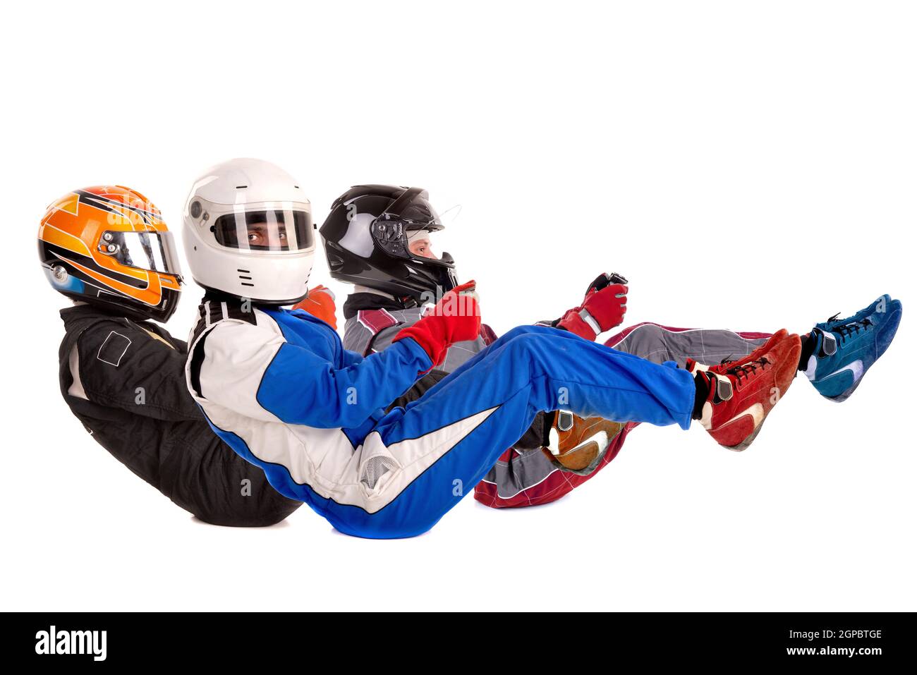 Racing drivers in racing position with complete gear isolated in white ...