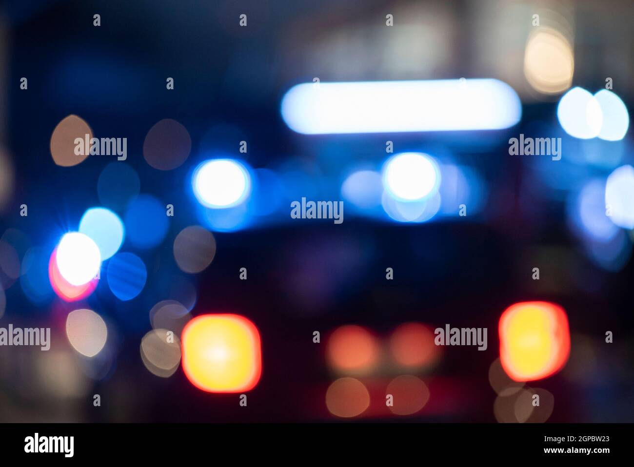 Detail of Blurred emergency background with blue lights in the city at ...