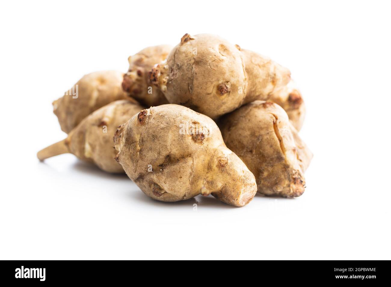Raw jerusalem artichoke. Topinambur vegetable root isolated on white ...