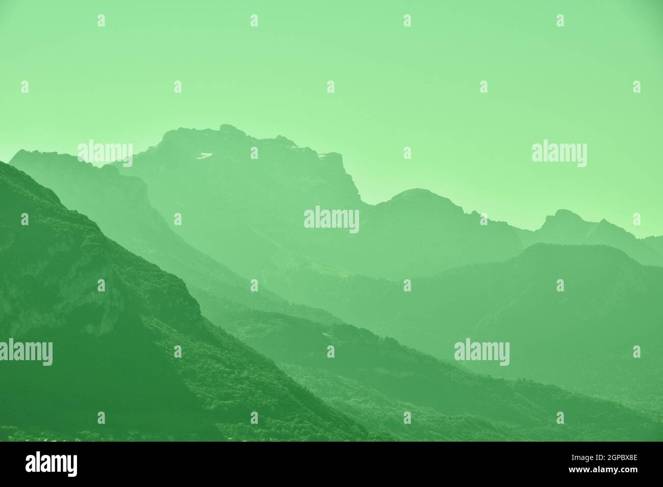 Green toned aerial perspective mountain range landscape with clear sky ...