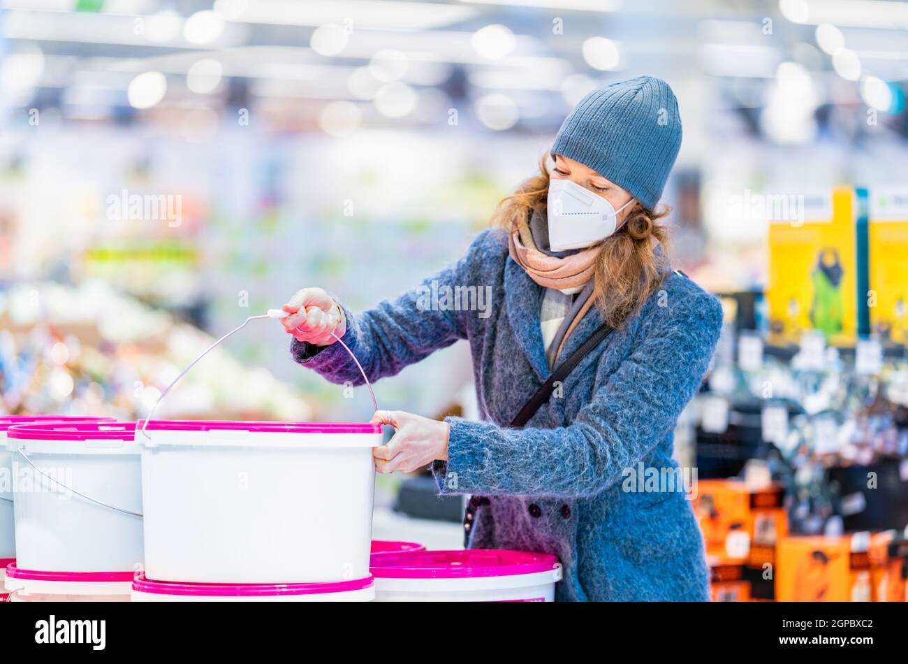 buying paint colors by young woman in the store Stock Photo - Alamy