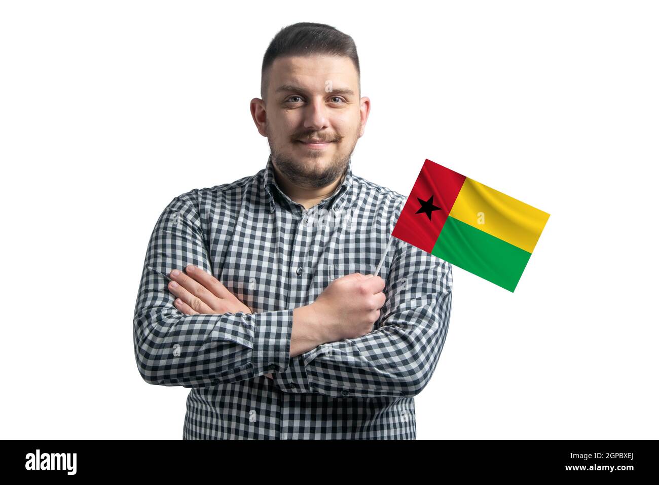White guy holding a flag of Guinea-Bissau smiling confident with ...