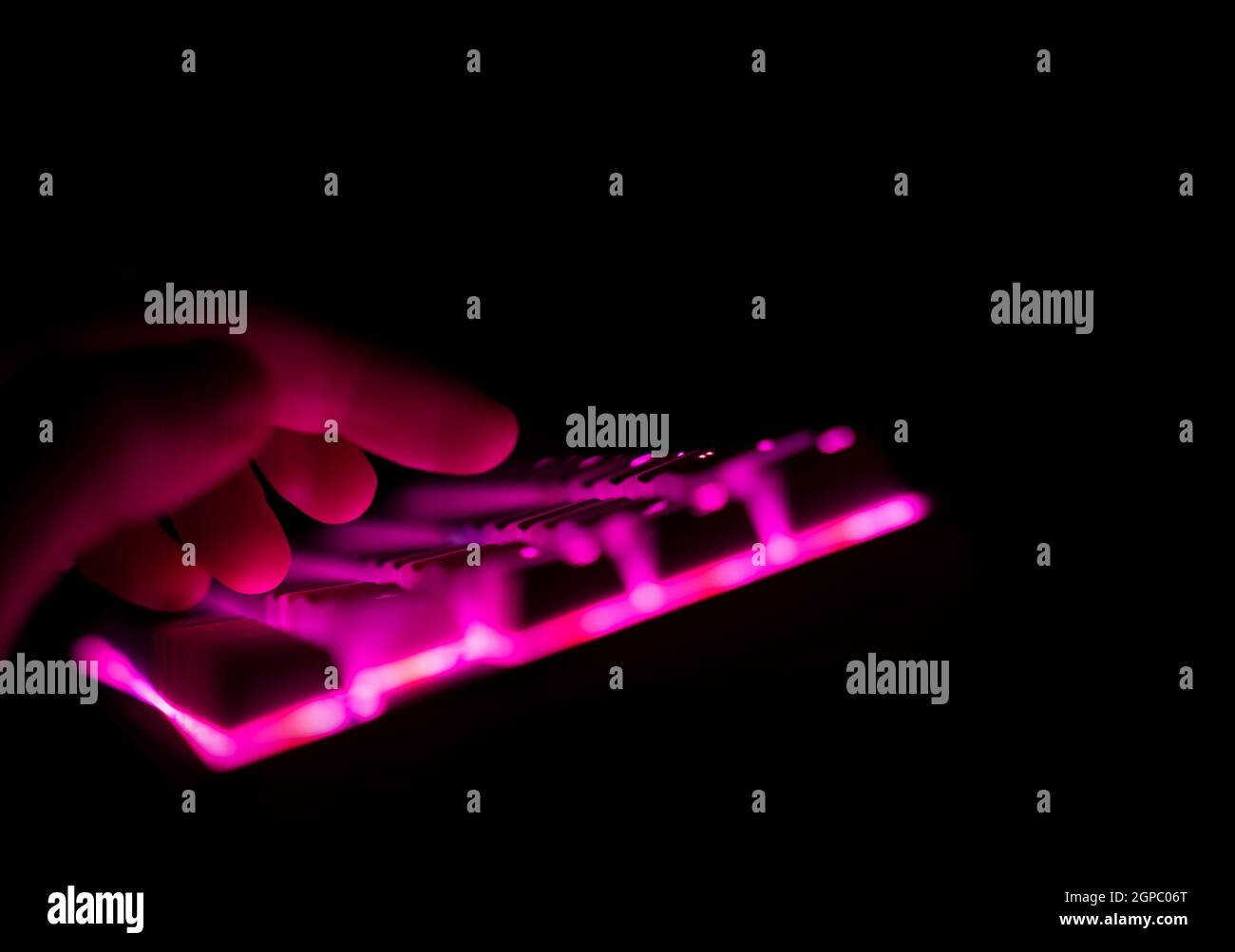 perspective side view detail closeup of male fingers typing on ...