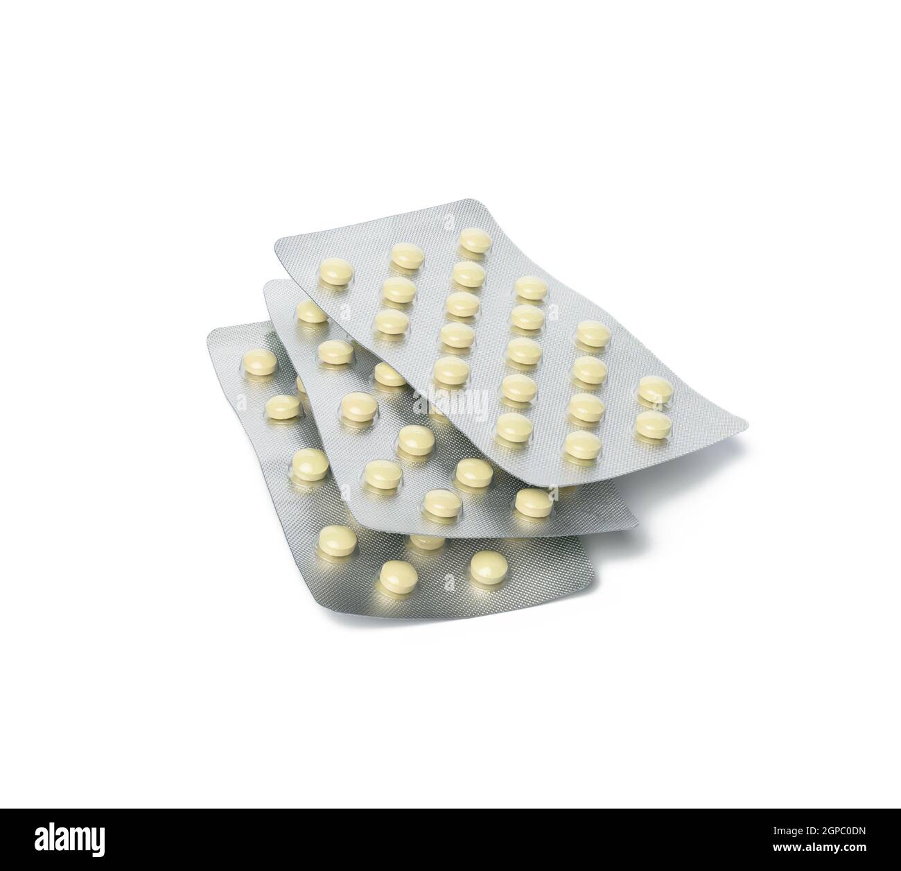 two packs of round pills in blister pack isolated on white background ...