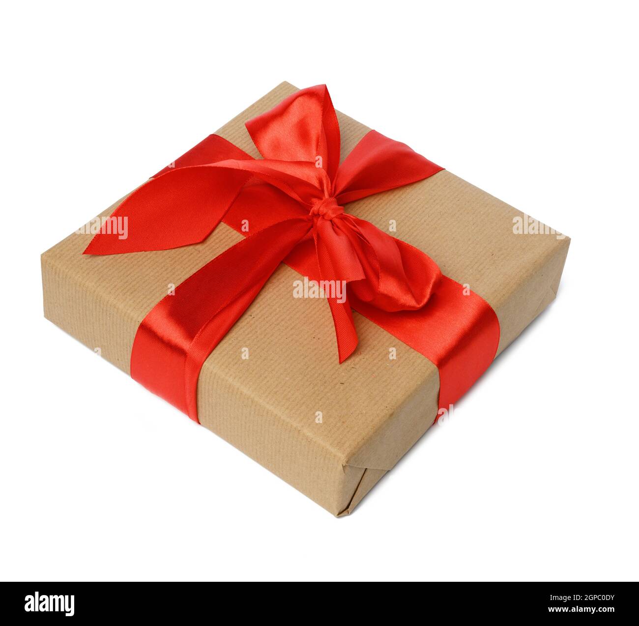 square box wrapped in brown kraft paper and tied with red silk ribbon ...