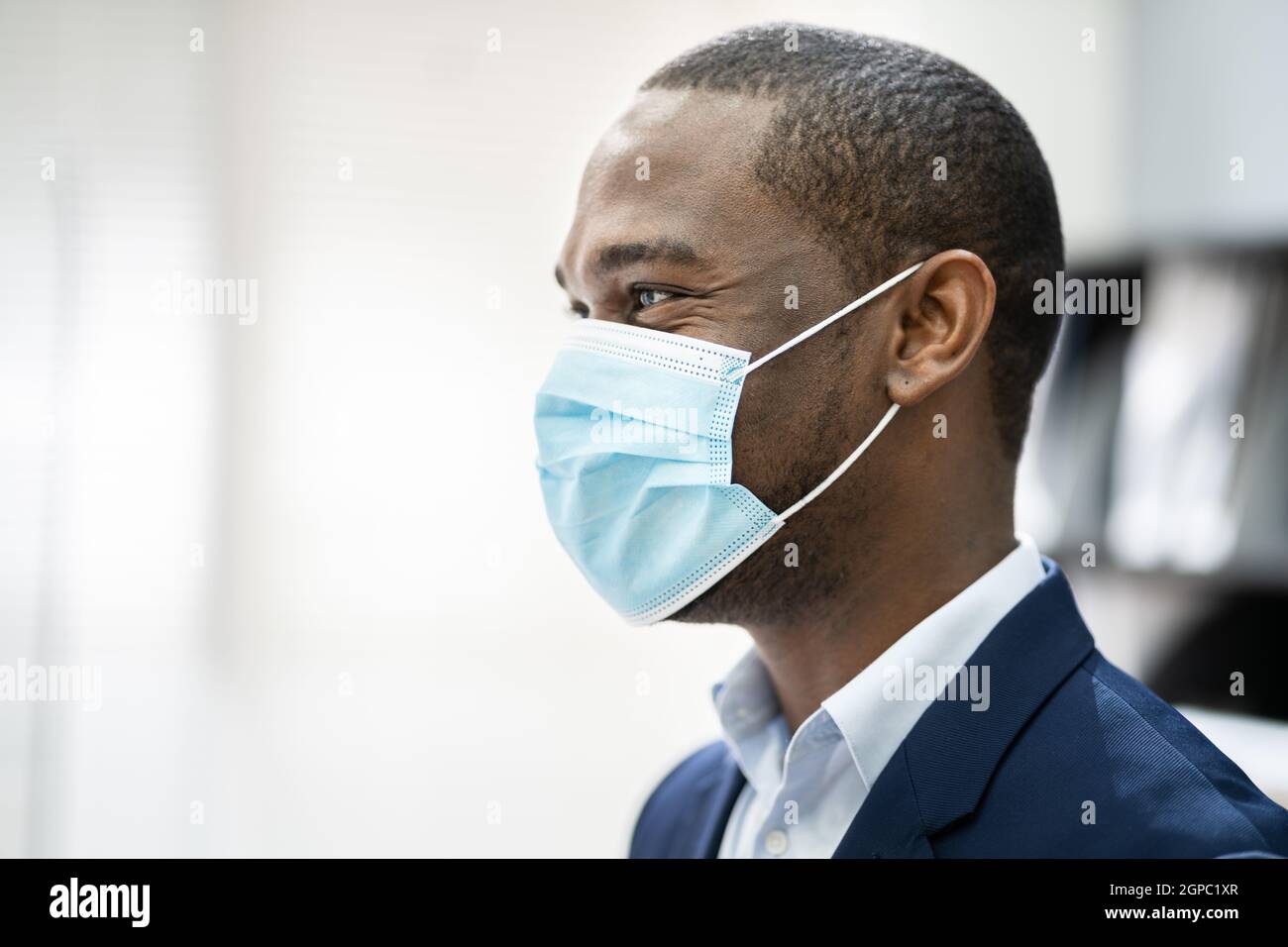 Receptionist Man Wearing Medical Mask At Office Reception Stock Photo ...