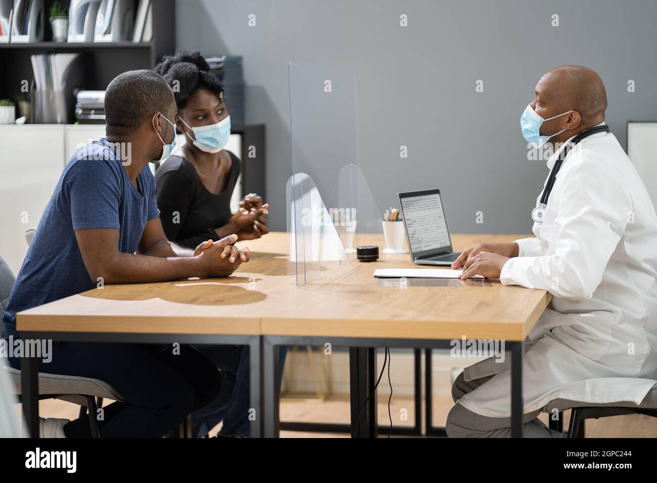 Couple Patient At Doctor With Pregnancy Lab Test Results Stock Photo ...