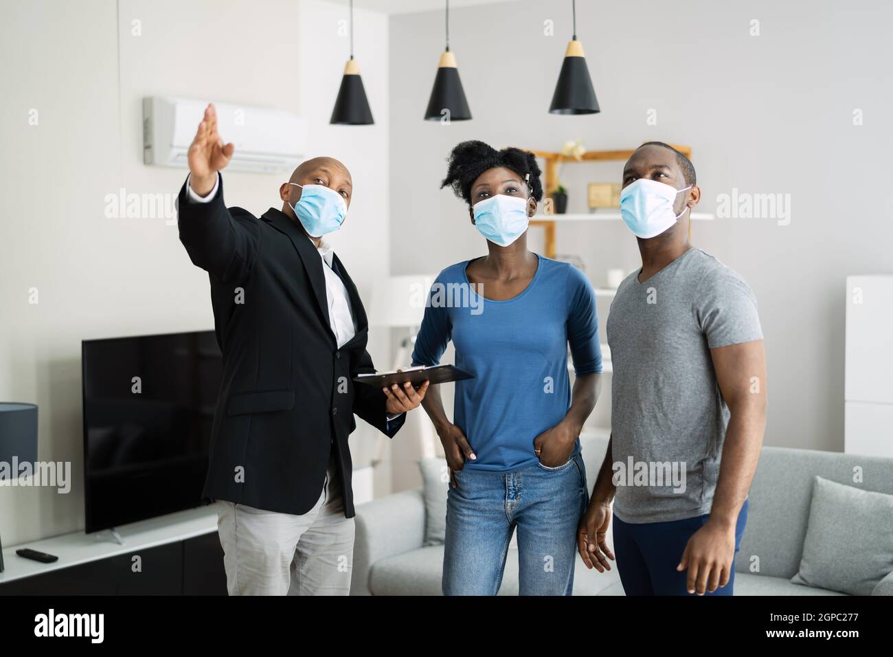 Real Estate House Tour With Realtor In Realtor Mask Stock Photo - Alamy