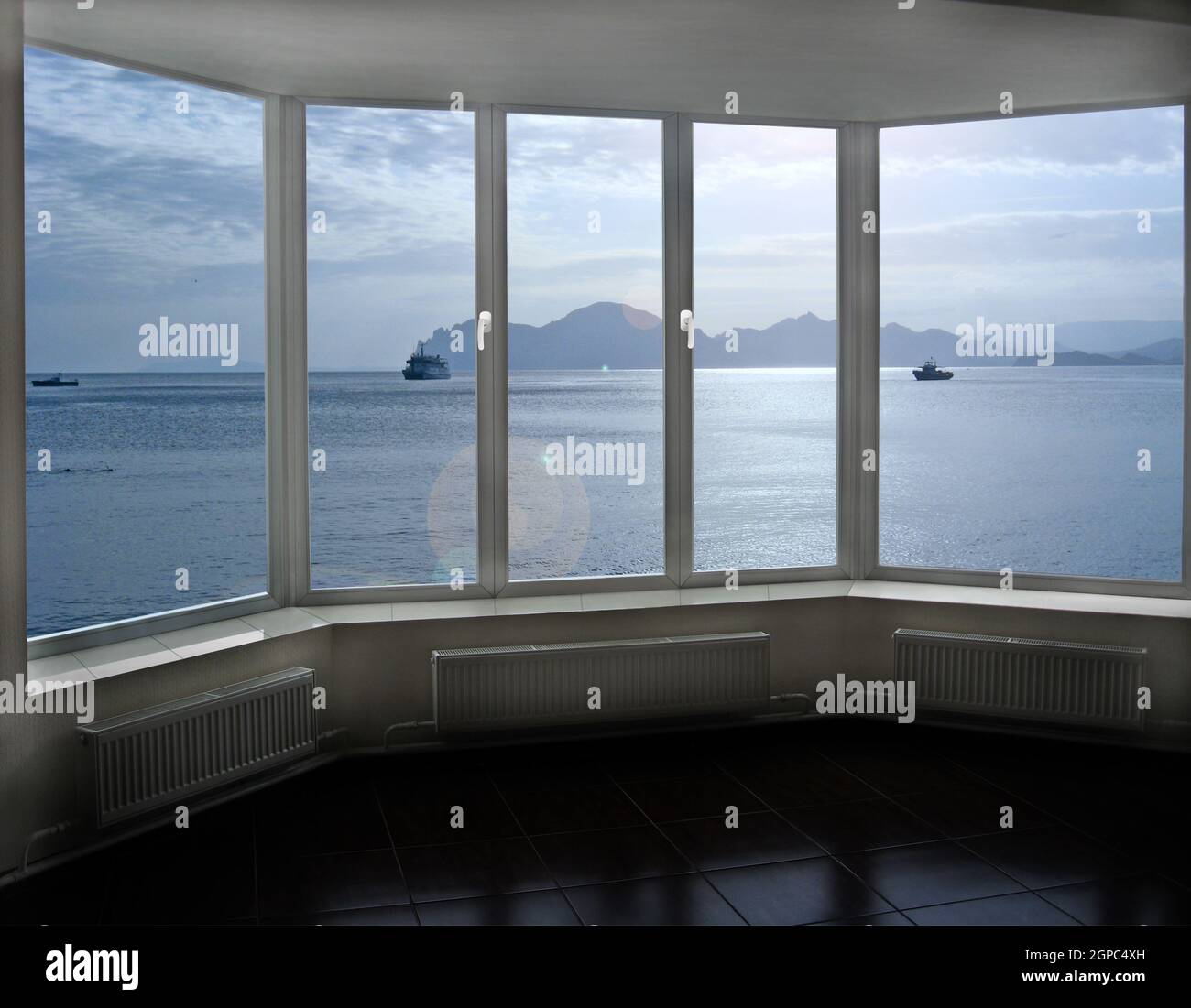 Panoramic window overlooking in ocean with ships. Domestic concept ...