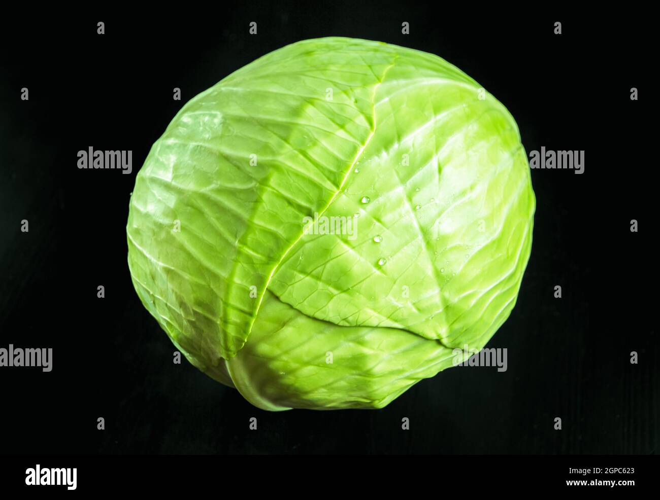 Green cabbage isolated on black background. Close-up view Stock Photo ...