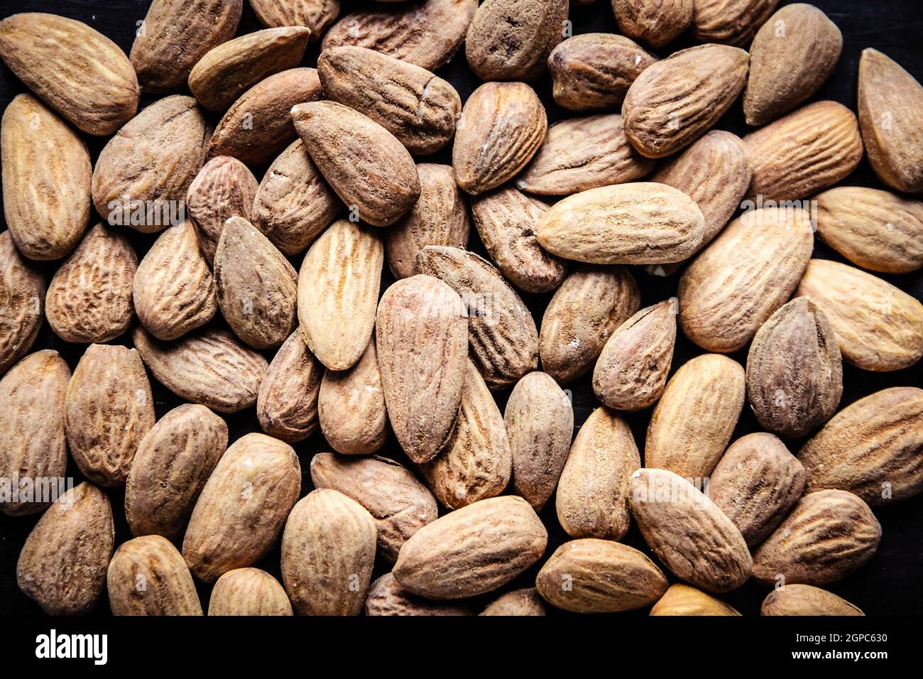Fresh organic almond background wallpaper. Top view Stock Photo - Alamy