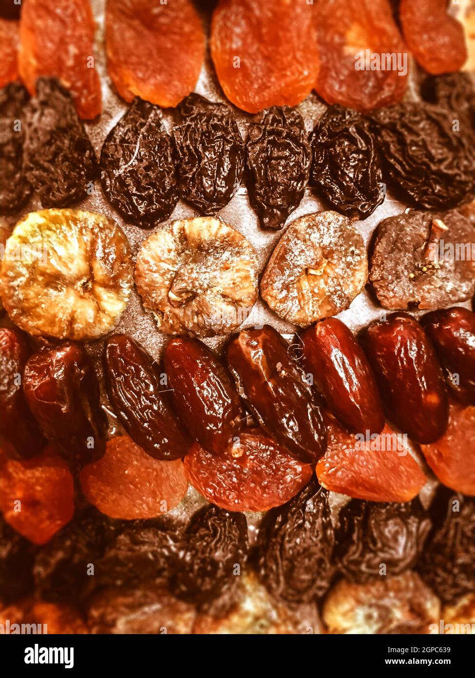 Organic dried fruits background made of figs, dates, prunes and ...
