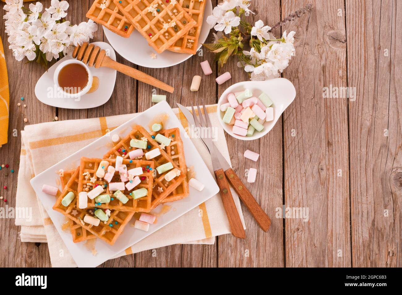 Waffles with colourful marshmallow Stock Photo - Alamy