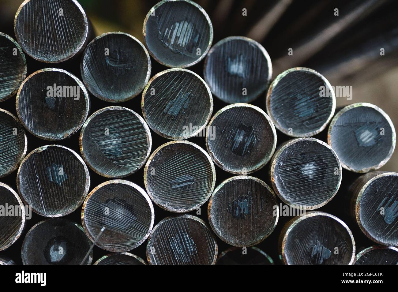 Hot rolled steel, stack of round thick metal rods close-up Stock Photo ...
