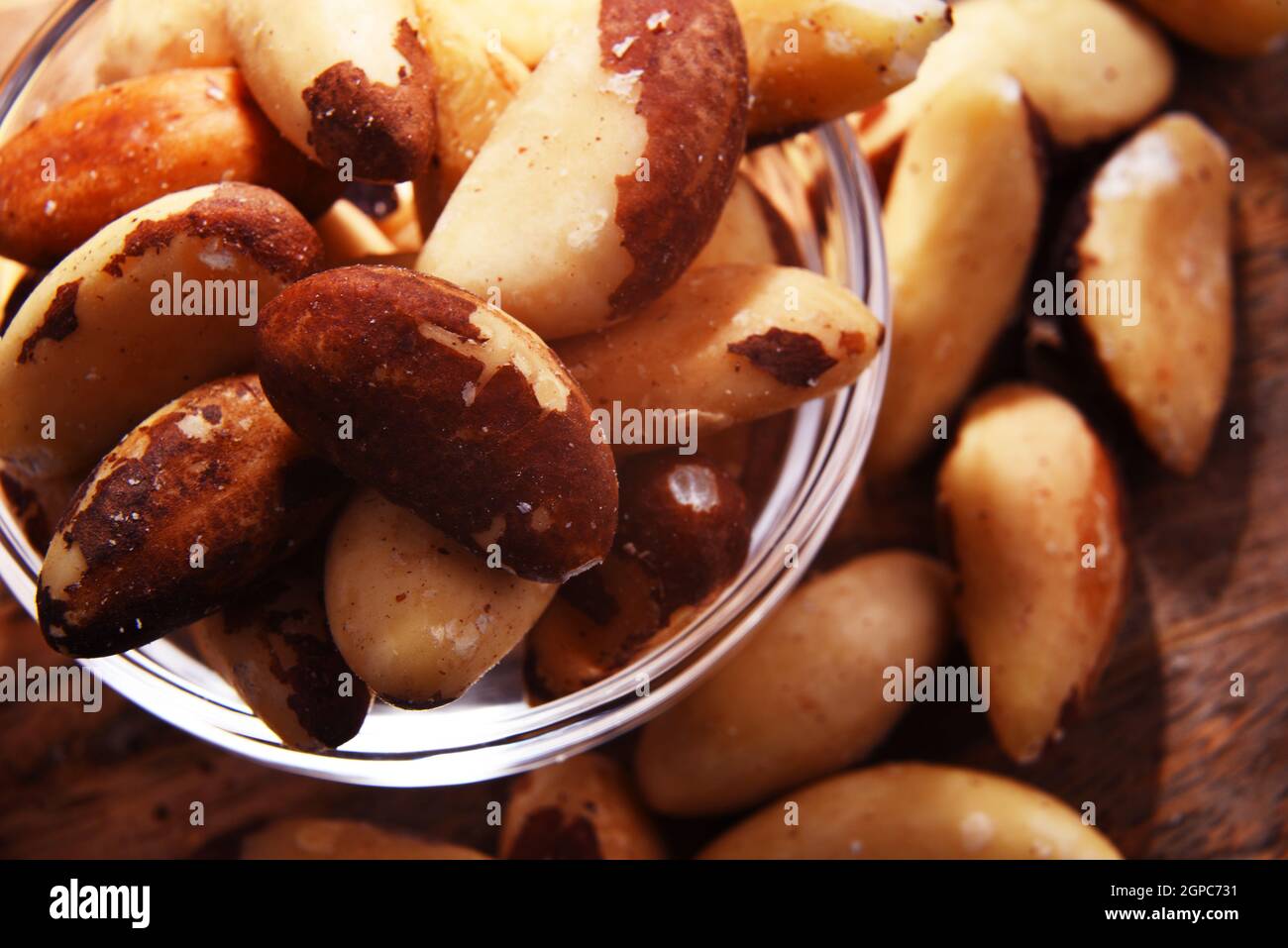 Composition with a bowl of shelled brazil nuts. Delicacies Stock Photo ...
