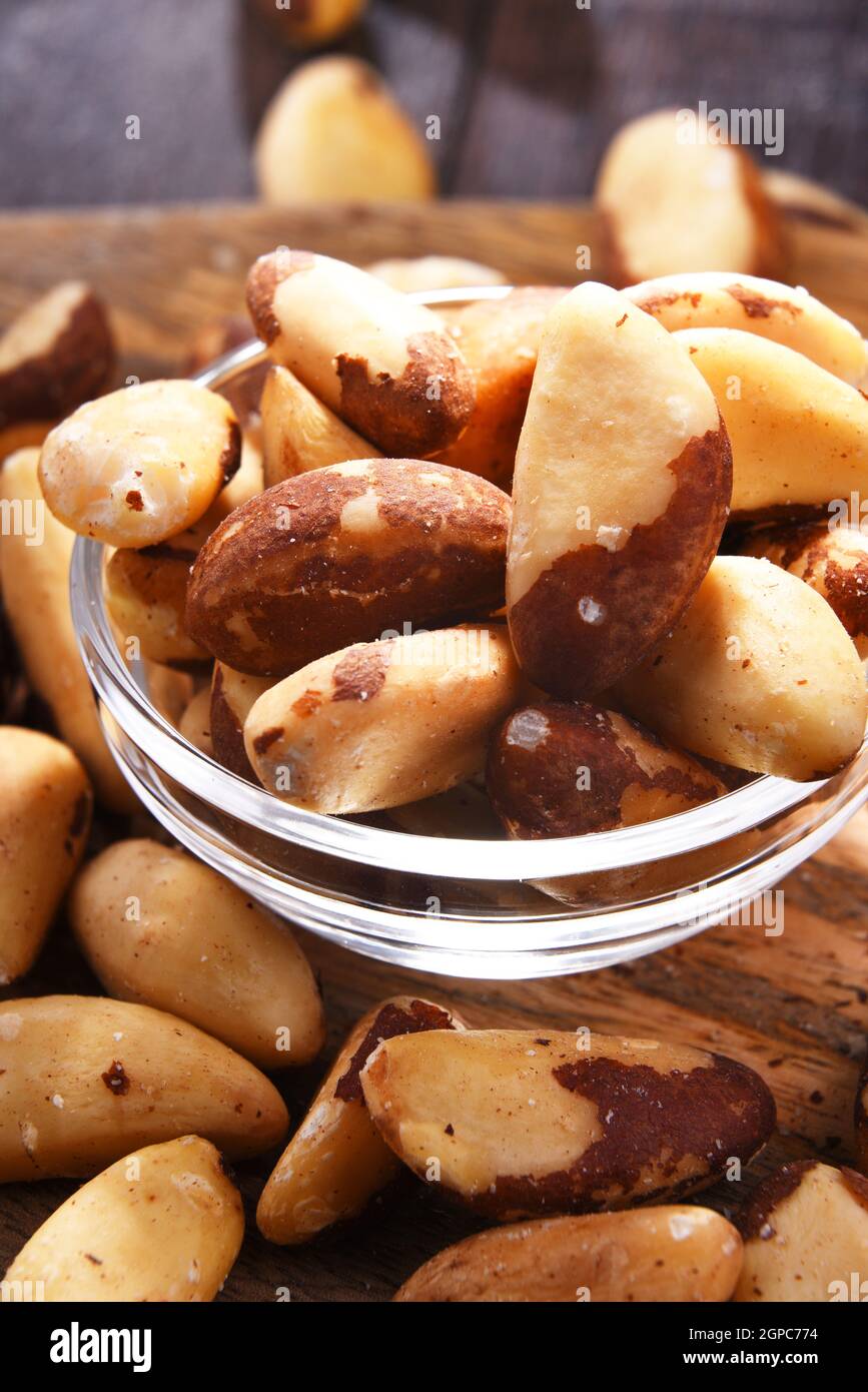 Composition with a bowl of shelled brazil nuts. Delicacies Stock Photo ...