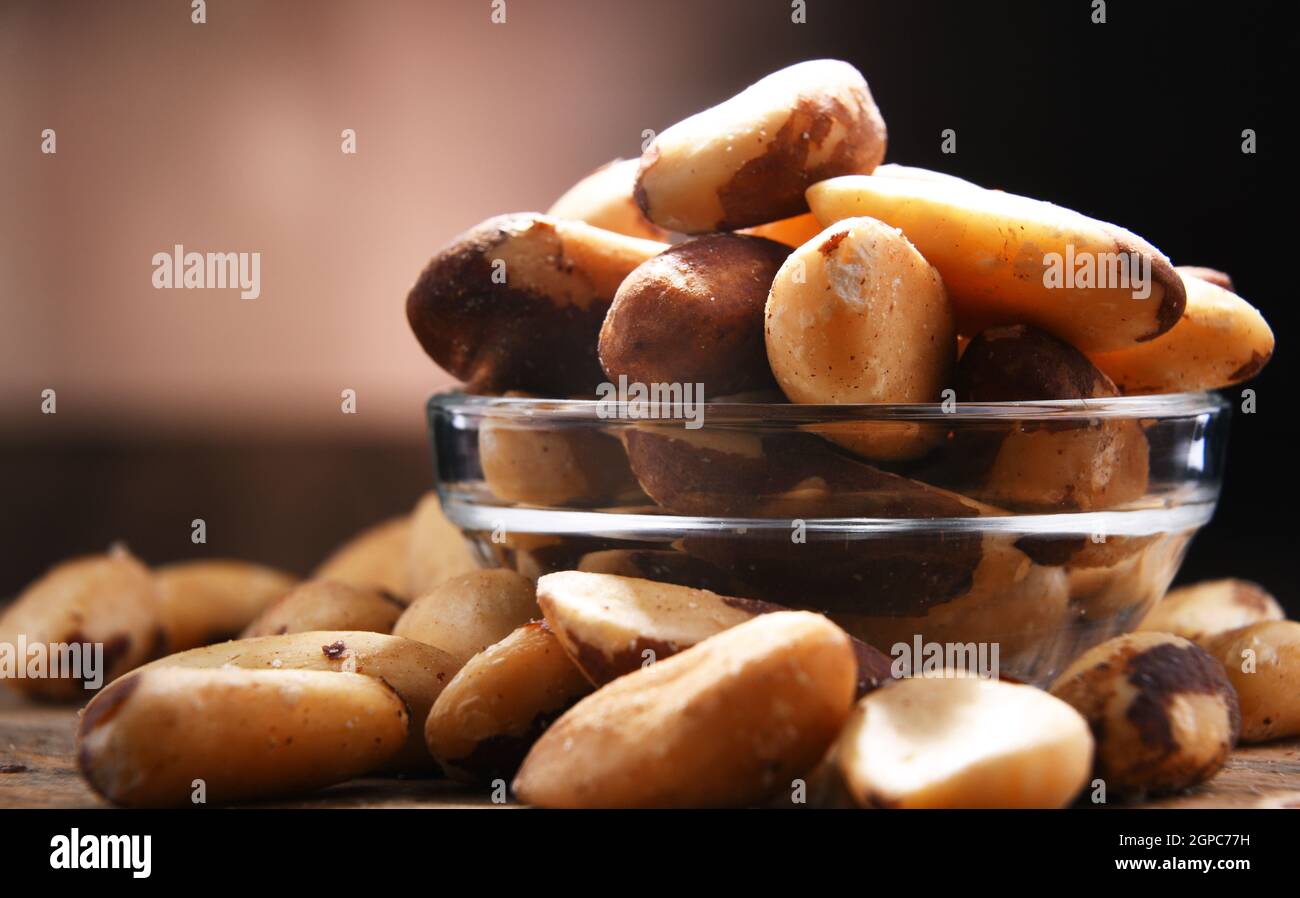Composition with a bowl of shelled brazil nuts. Delicacies Stock Photo ...