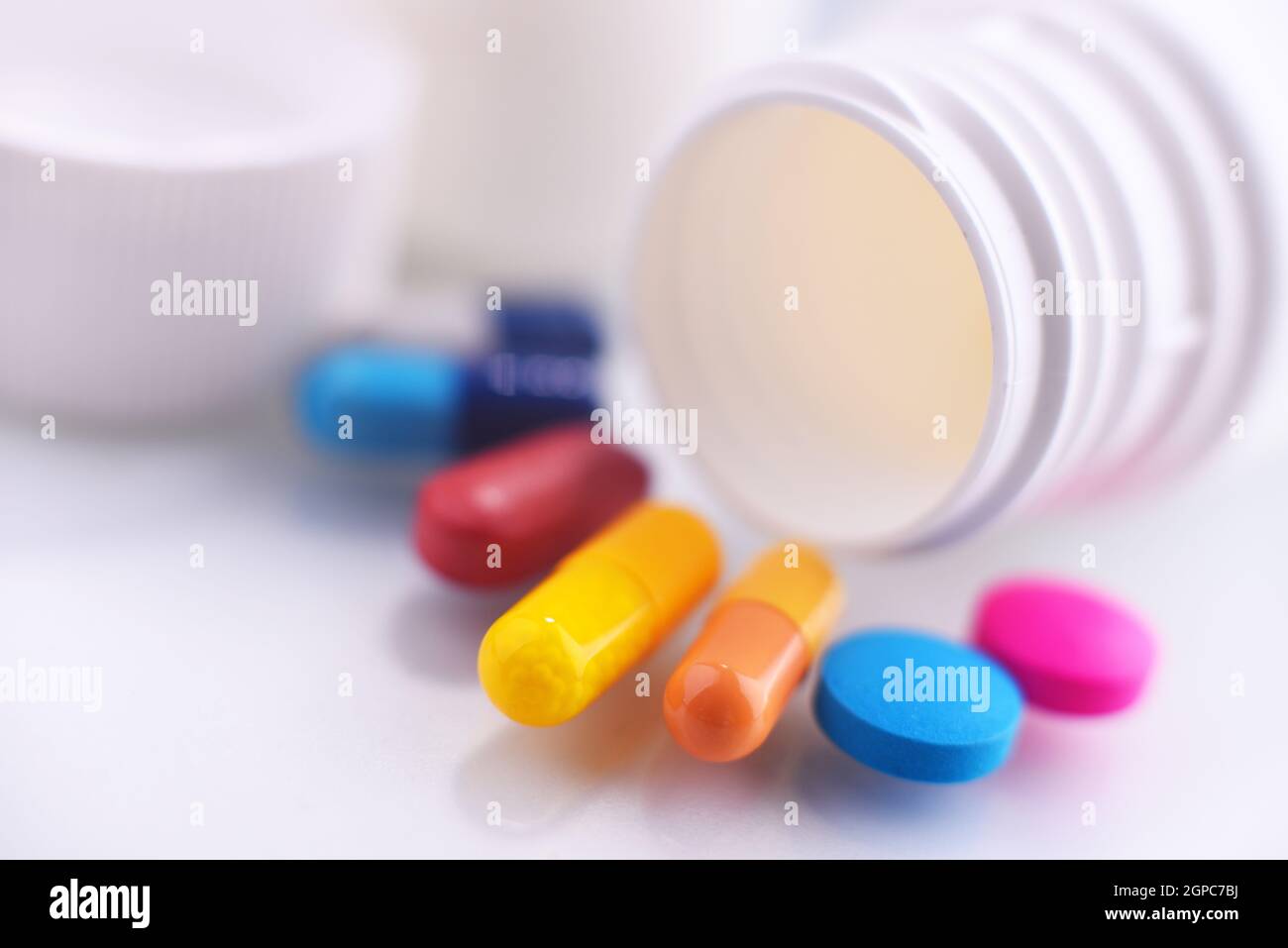 Composition with variety of drug pills and container Stock Photo - Alamy