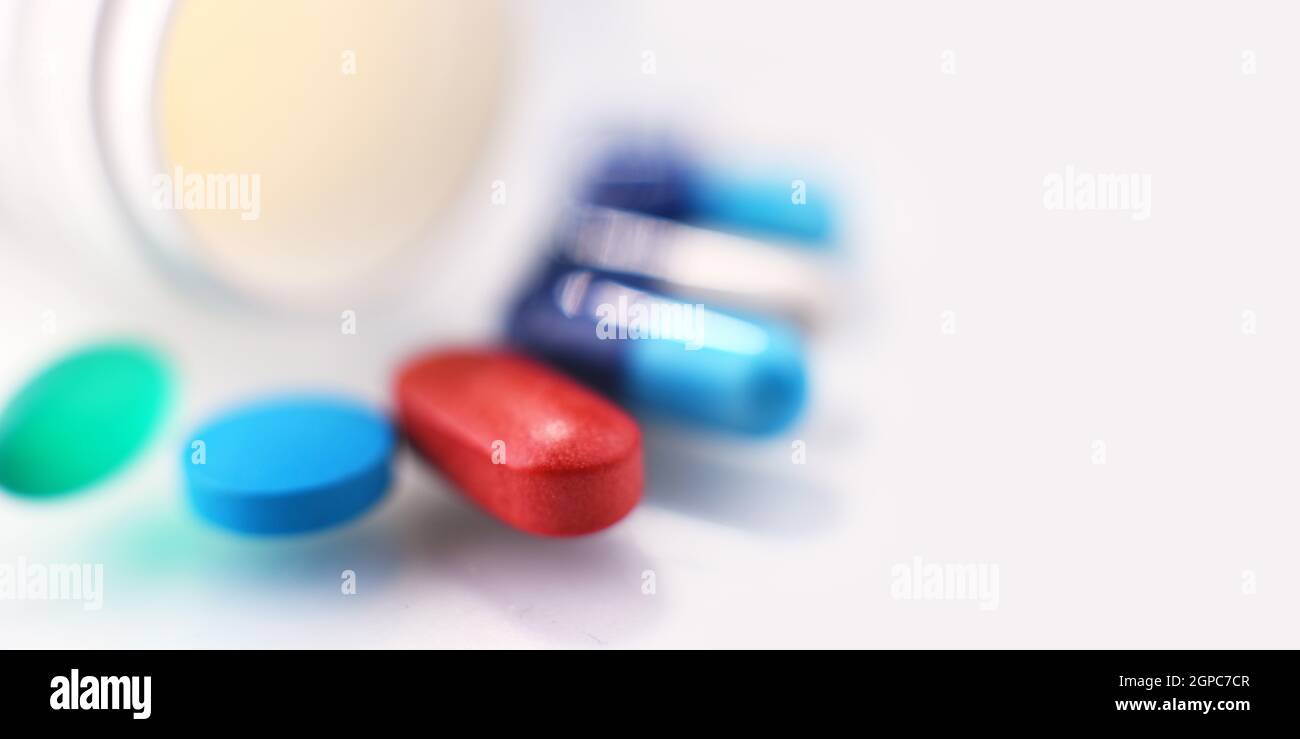 Composition with variety of drug pills and container Stock Photo - Alamy