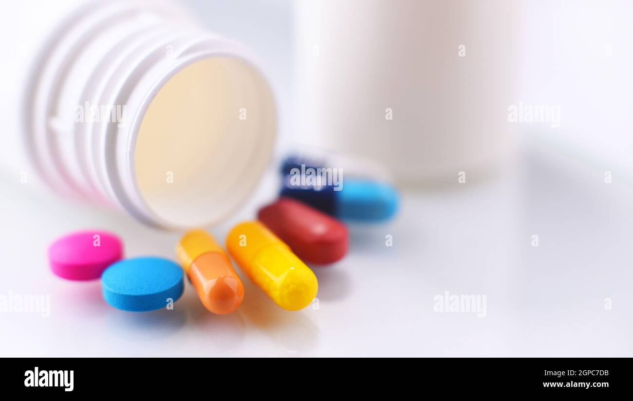 Composition with variety of drug pills and container Stock Photo - Alamy