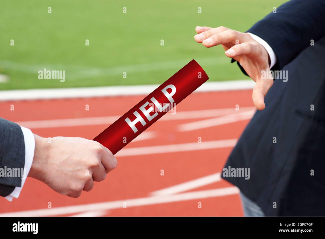 Businessmen hand over help assistance baton in relay race in stadium ...