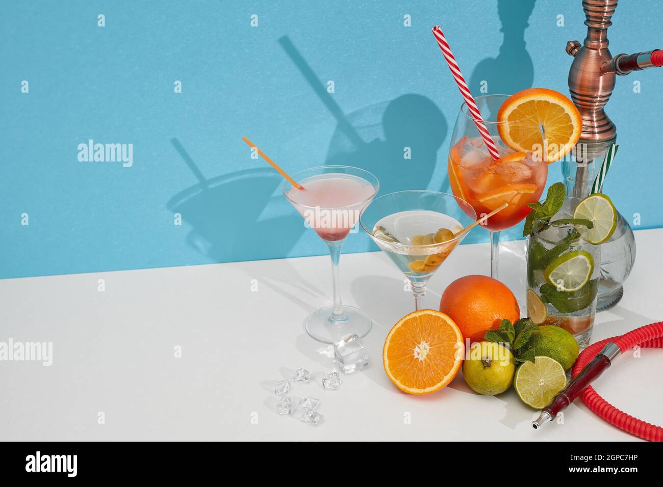 Cocktails set. Hookah (shisha) and glasses with various cold beverages ...