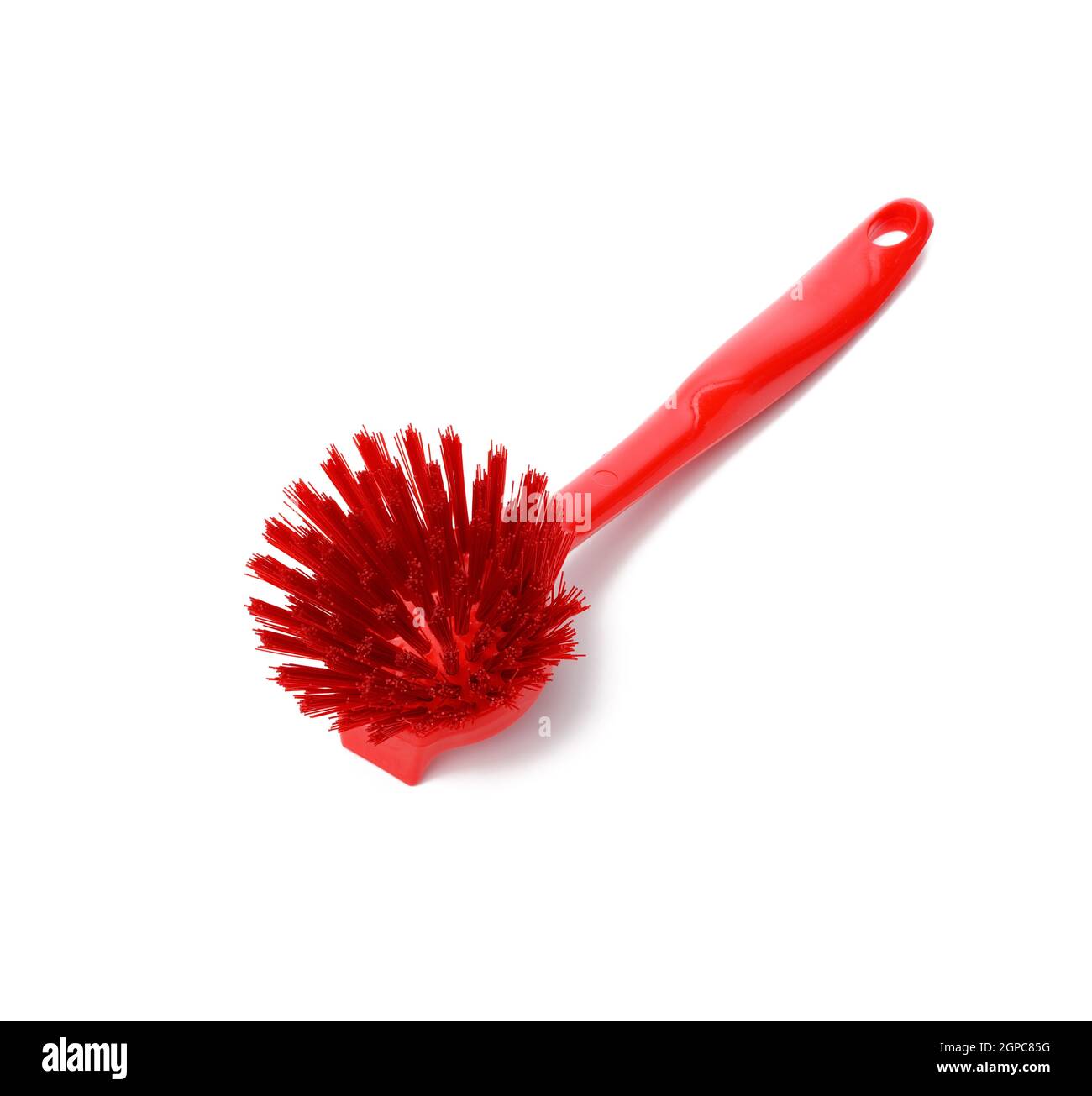 red plastic brush with handle for cleaning isolated on white background ...