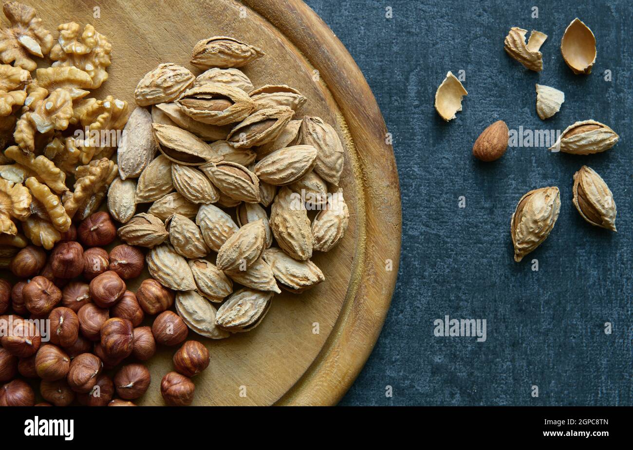 Almonds, hazelnuts, walnuts, top view, healthy diet Stock Photo - Alamy