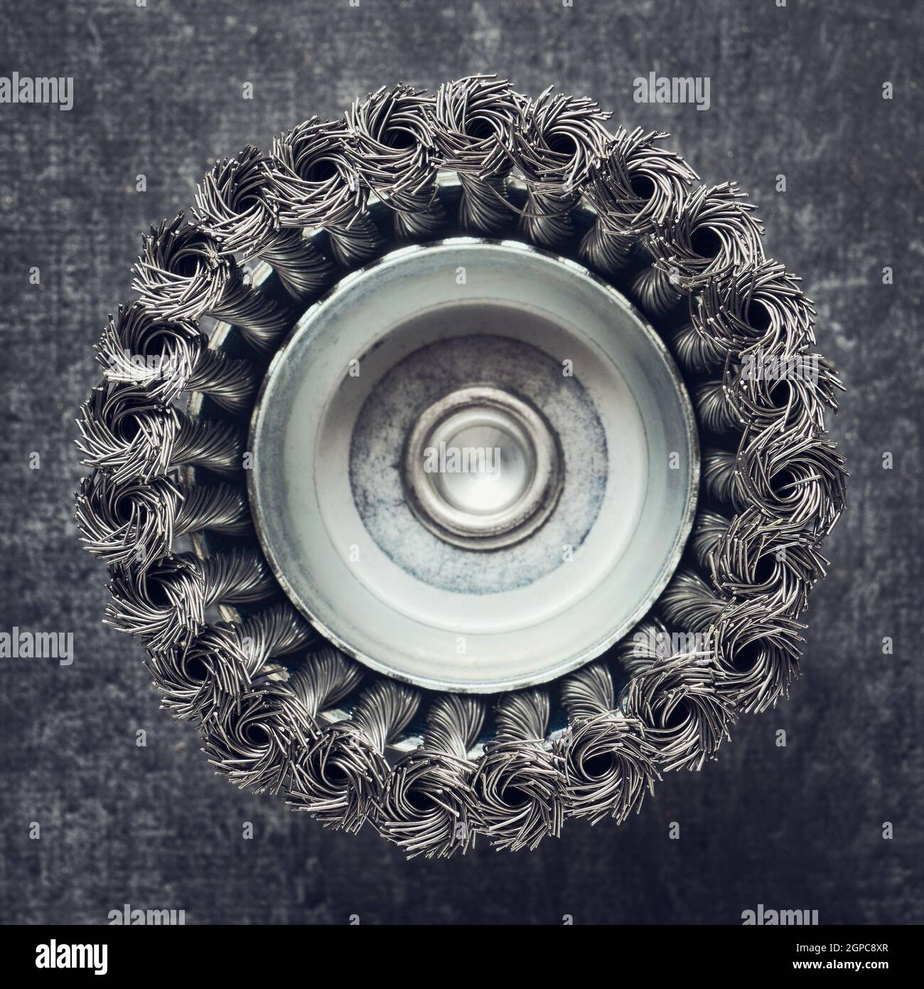 Grinding round brush for machining metal surfaces, close up, shallow ...
