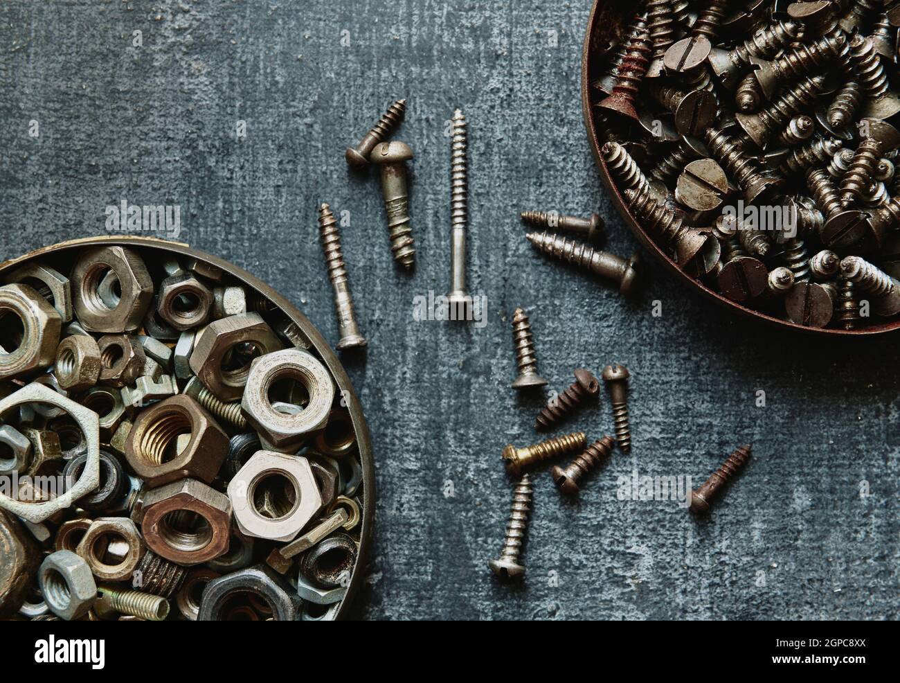 Old nuts and screws top view, close up, stylized Stock Photo - Alamy