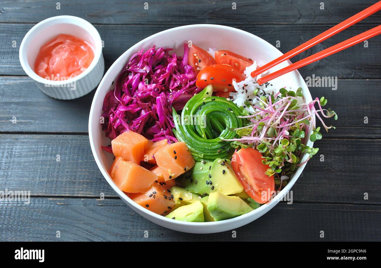 Organic food. Fresh seafood recipe. Fresh salmon poke bowl with rice ...