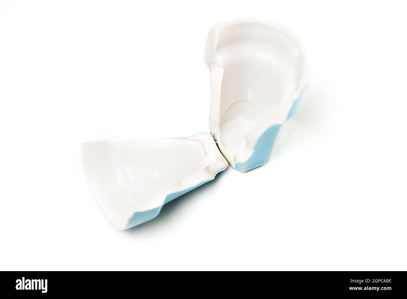 Broken blue teacup isolated on white background Stock Photo - Alamy