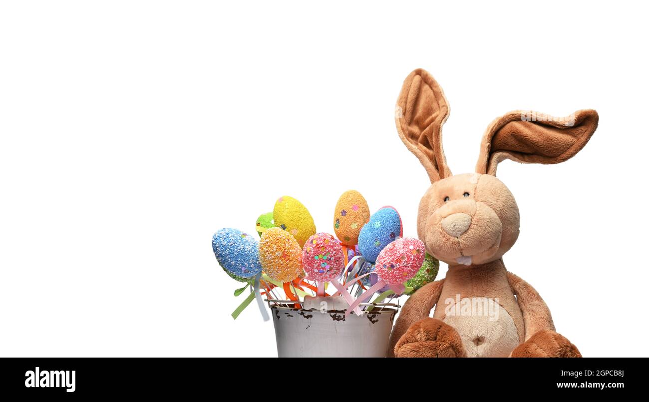 teddy bunny sitting on a white background and decorative colorful ...