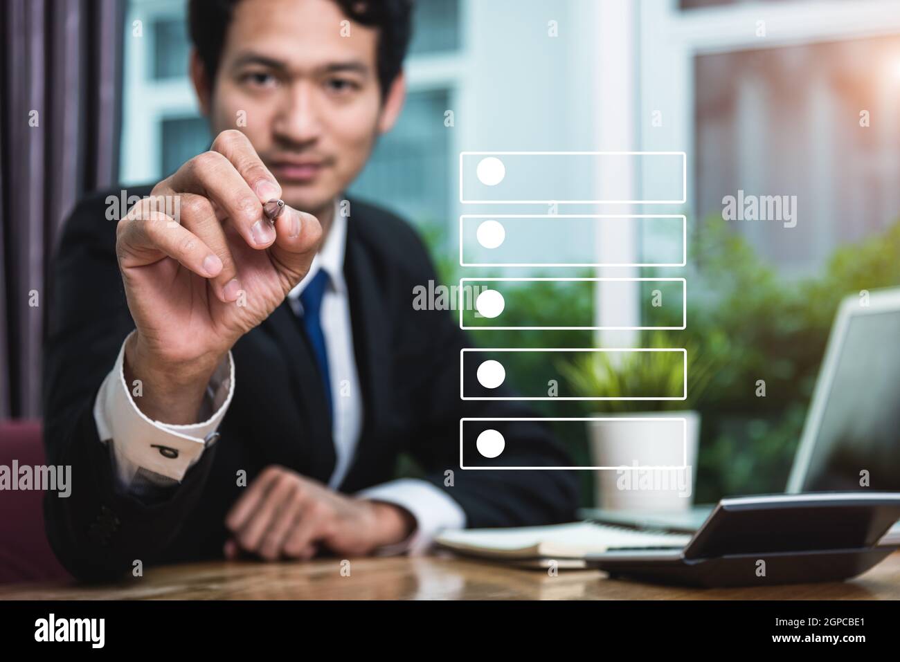 Business man hand holding pen draw select checking box Stock Photo - Alamy