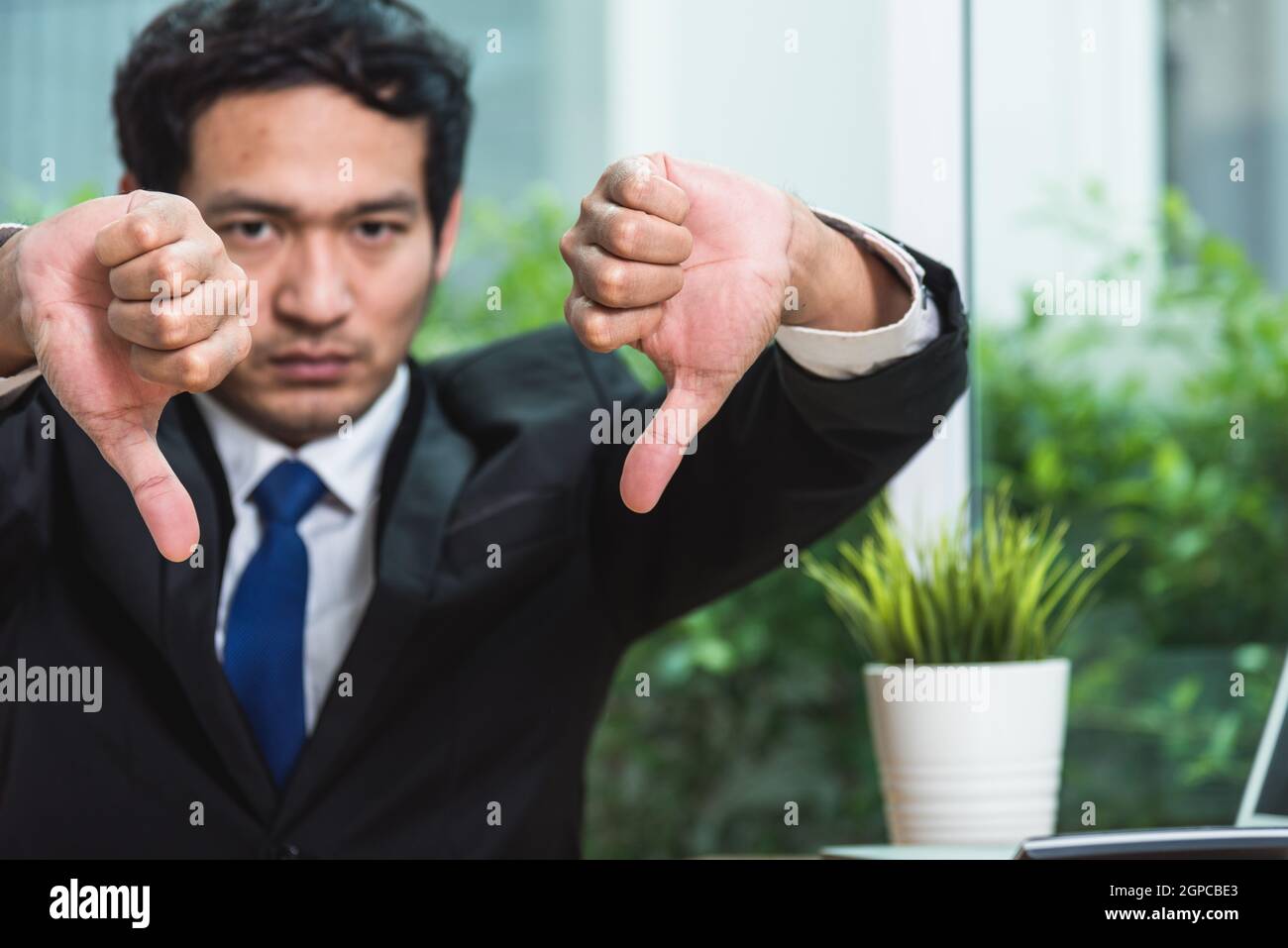 Businessman thumbs down hi-res stock photography and images - Alamy