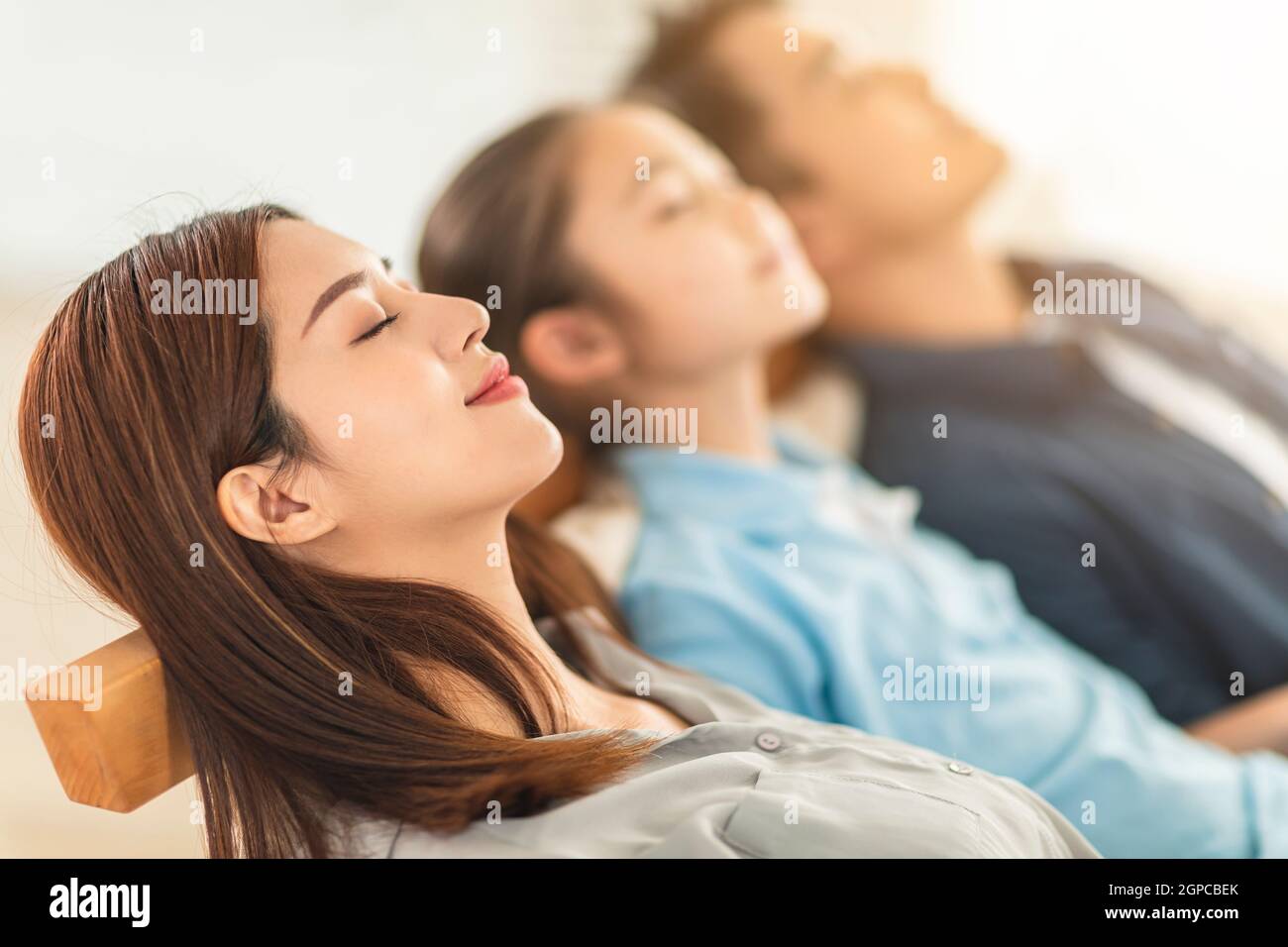 family enjoying peaceful rest breathing fresh air at home on ...