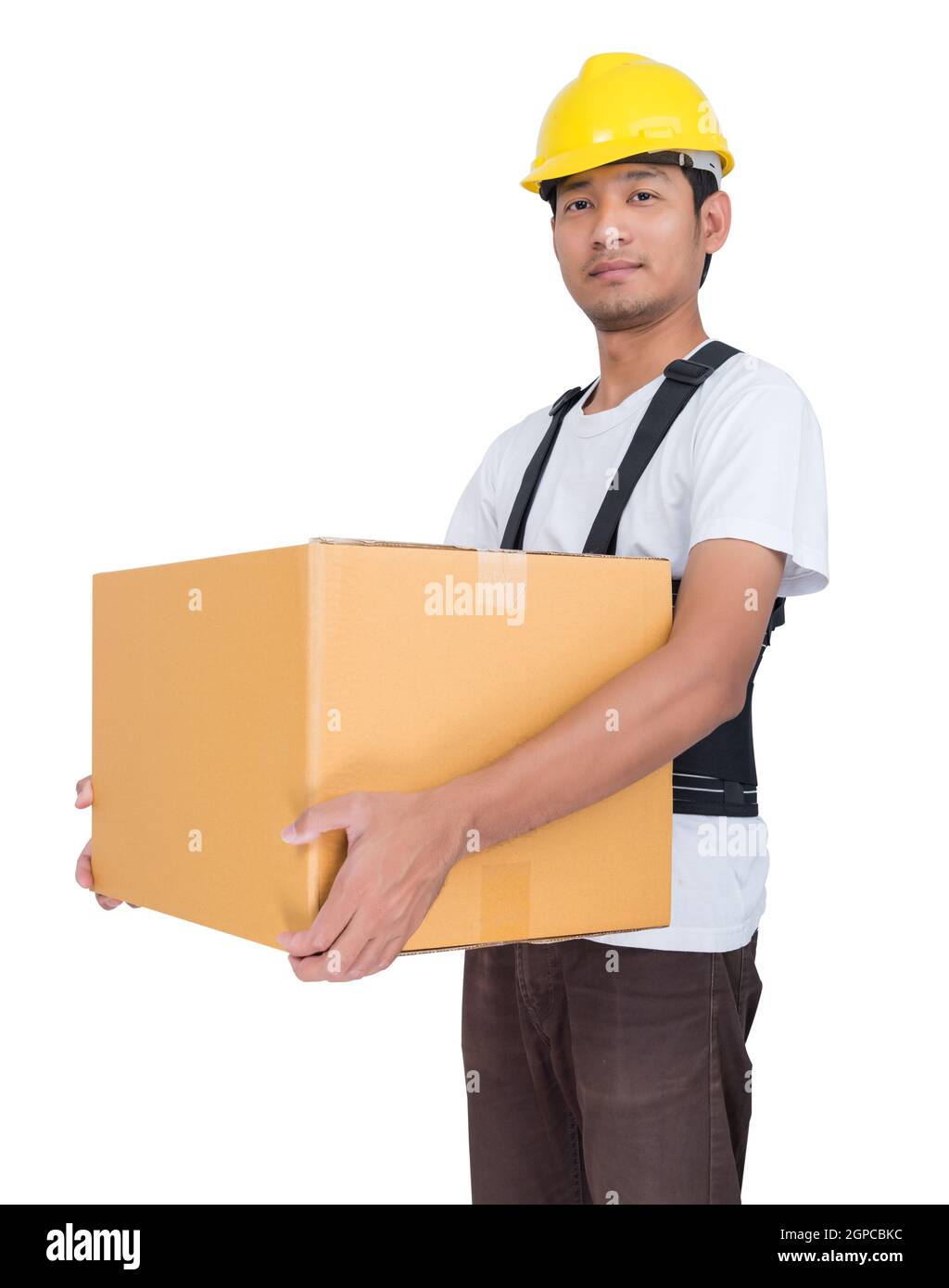 Smiling man lifts a cardboard box wearing back support belt for protect ...