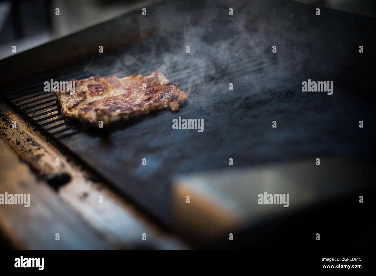 Close up shot of a slice of beef roasted on a barbecue grill Stock ...